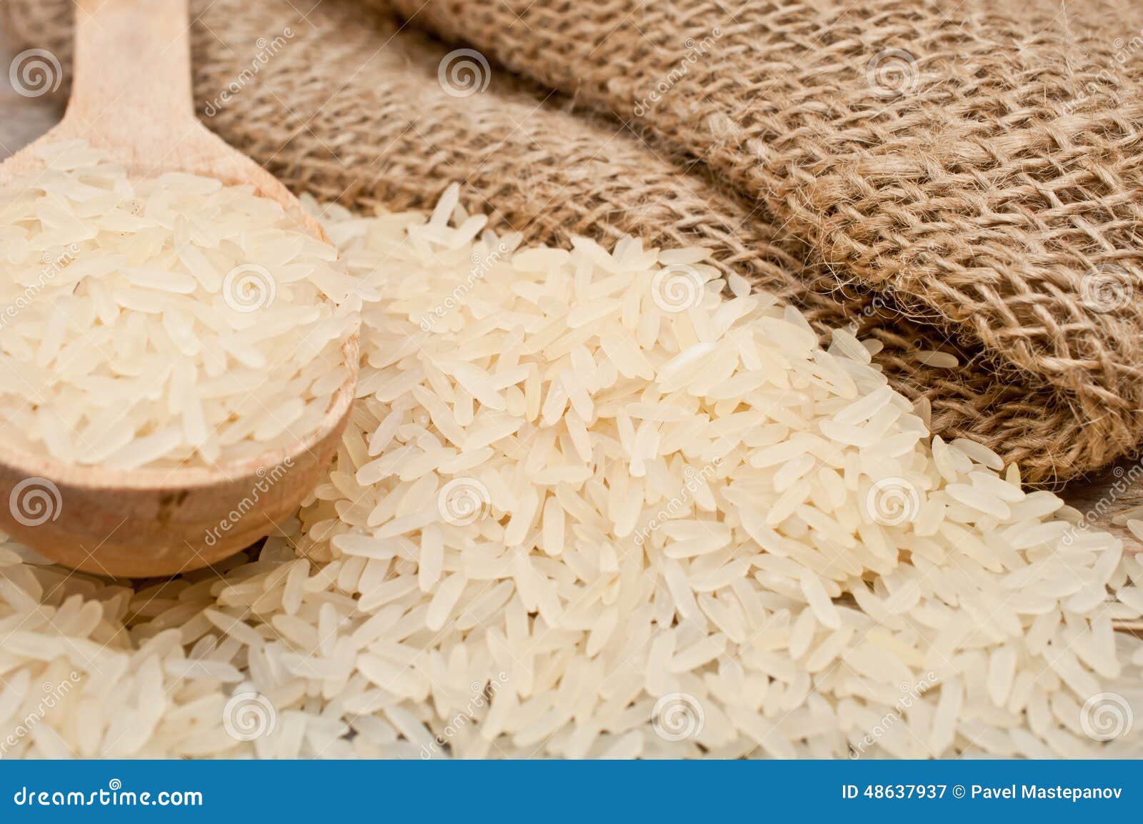 Rice from and wooden spoon stock image. Image of rice - 48637937
