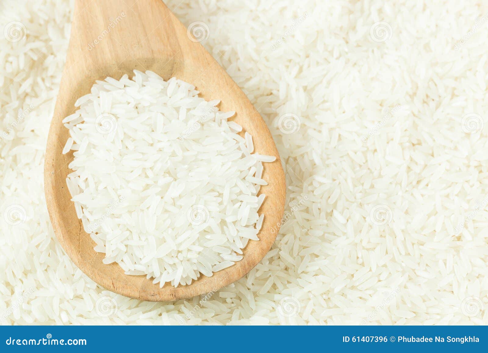 Rice on wooden spoon stock photo. Image of natural, diet - 61407396