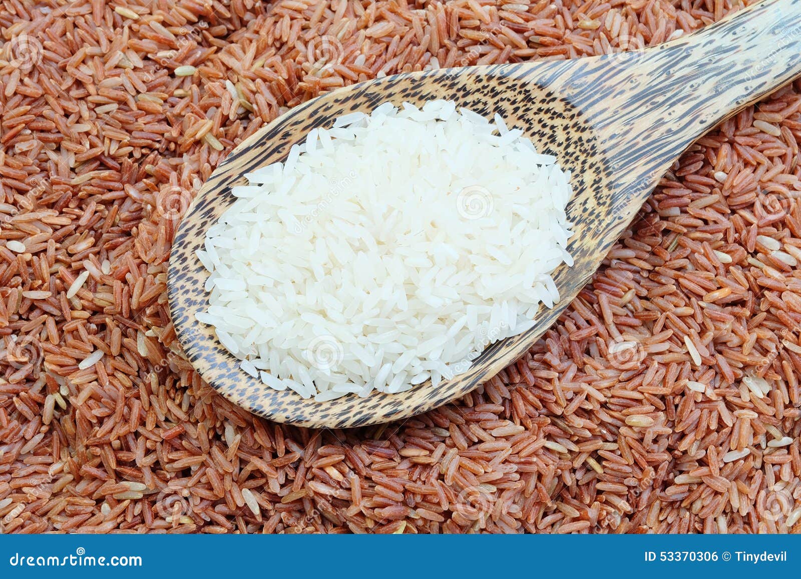Rice in wooden spoon stock photo. Image of food, vegetarian - 53370306