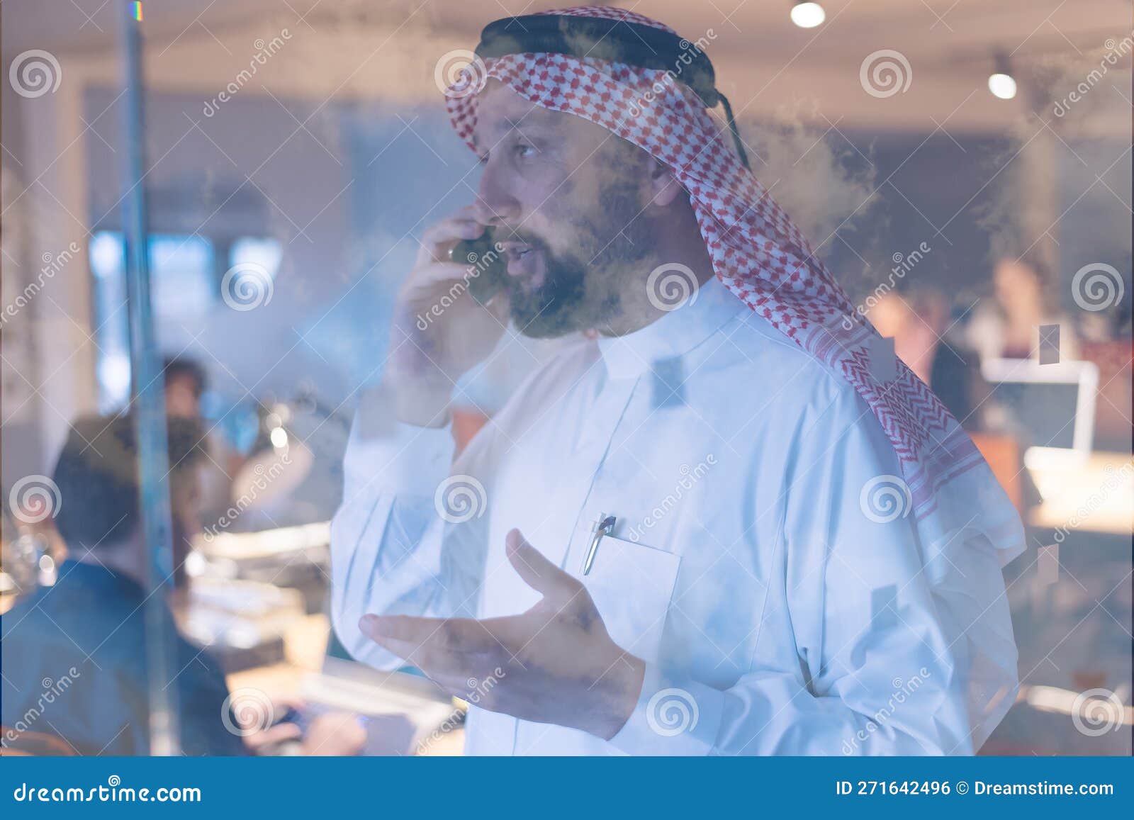 Rich Arabic Saudi Businessman Checking Smart Phone in Office Stock ...