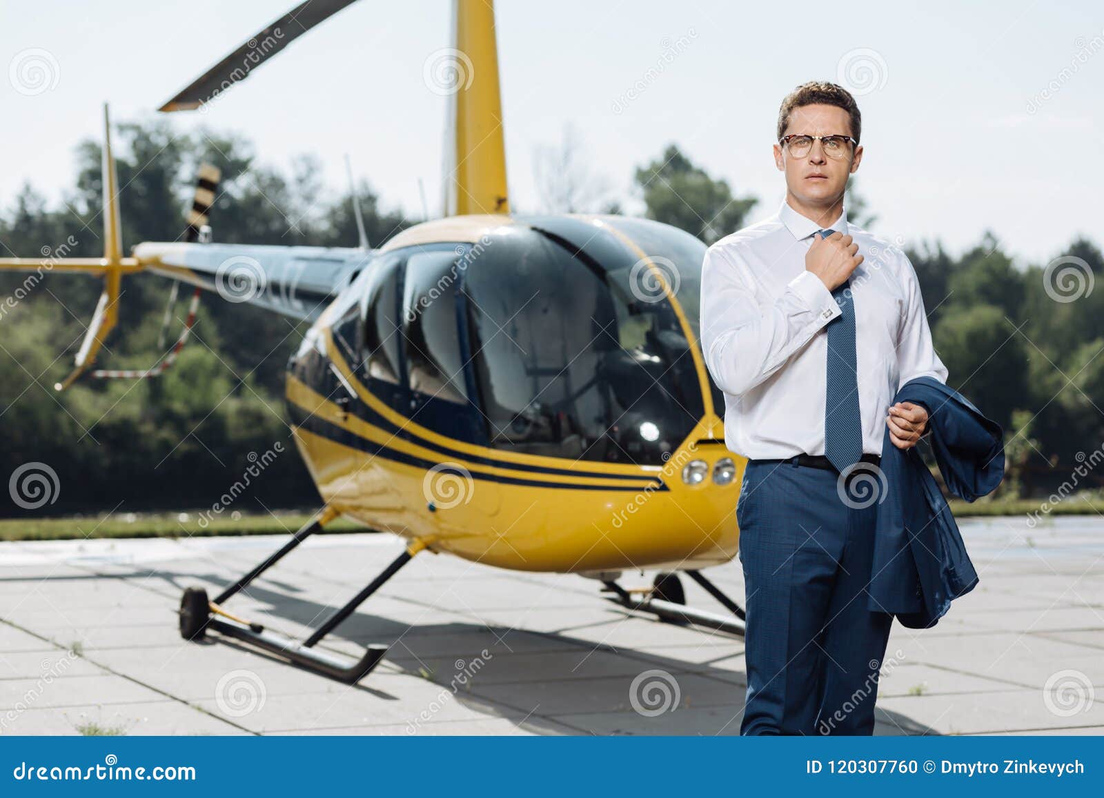 Handsome Young CEO Standing at a Helipad Stock Photo - Image of outfit ...