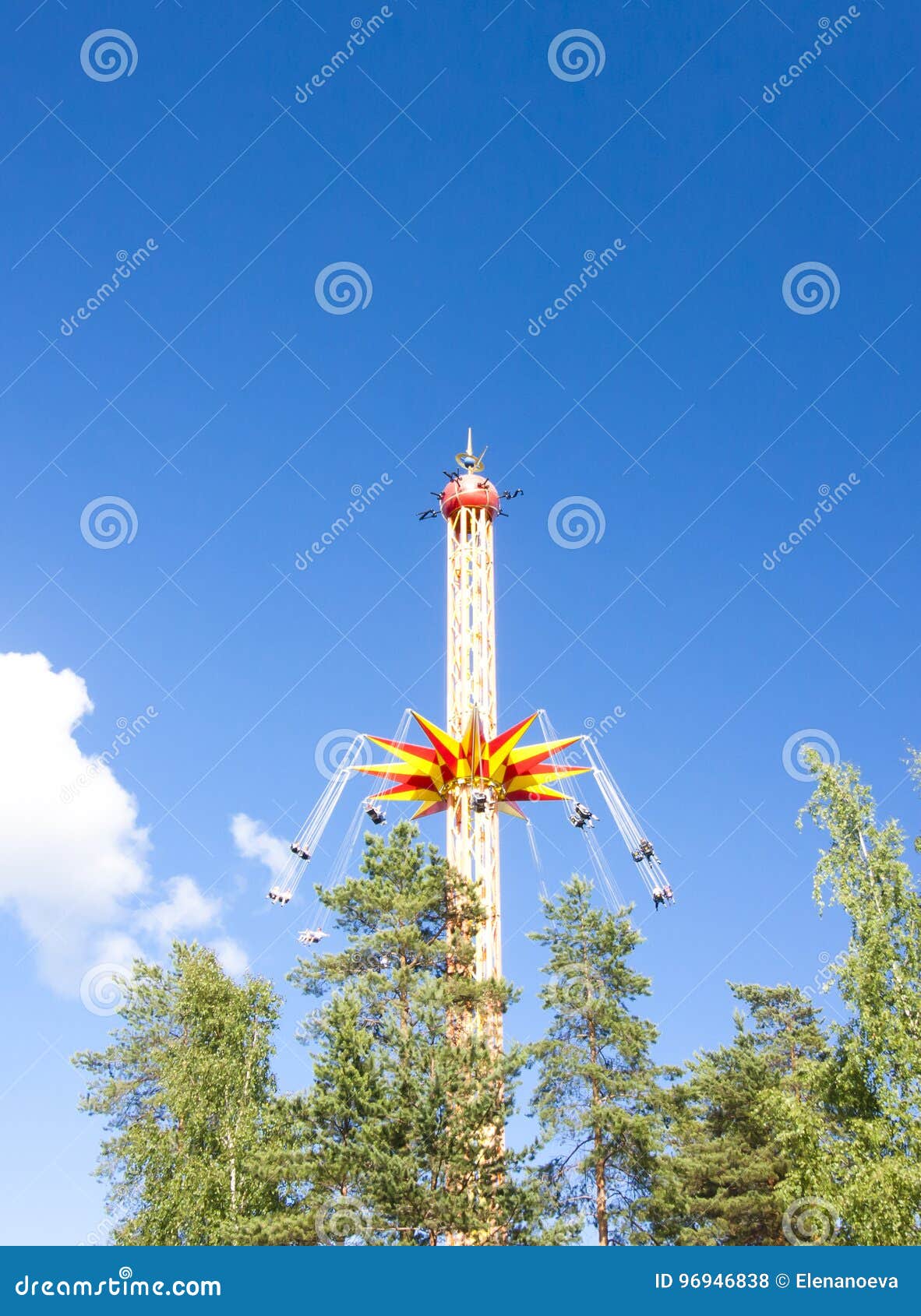 Ride in Motion at Amusement Park on Blue Sky Background. Stock Photo ...