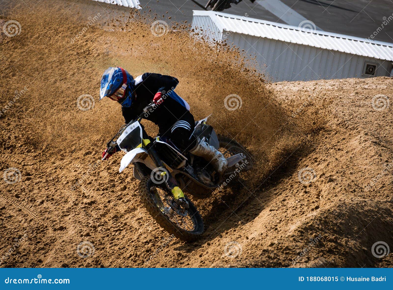A Rider on Motorcycle Throwing the Dust from His Tire while Turning and ...