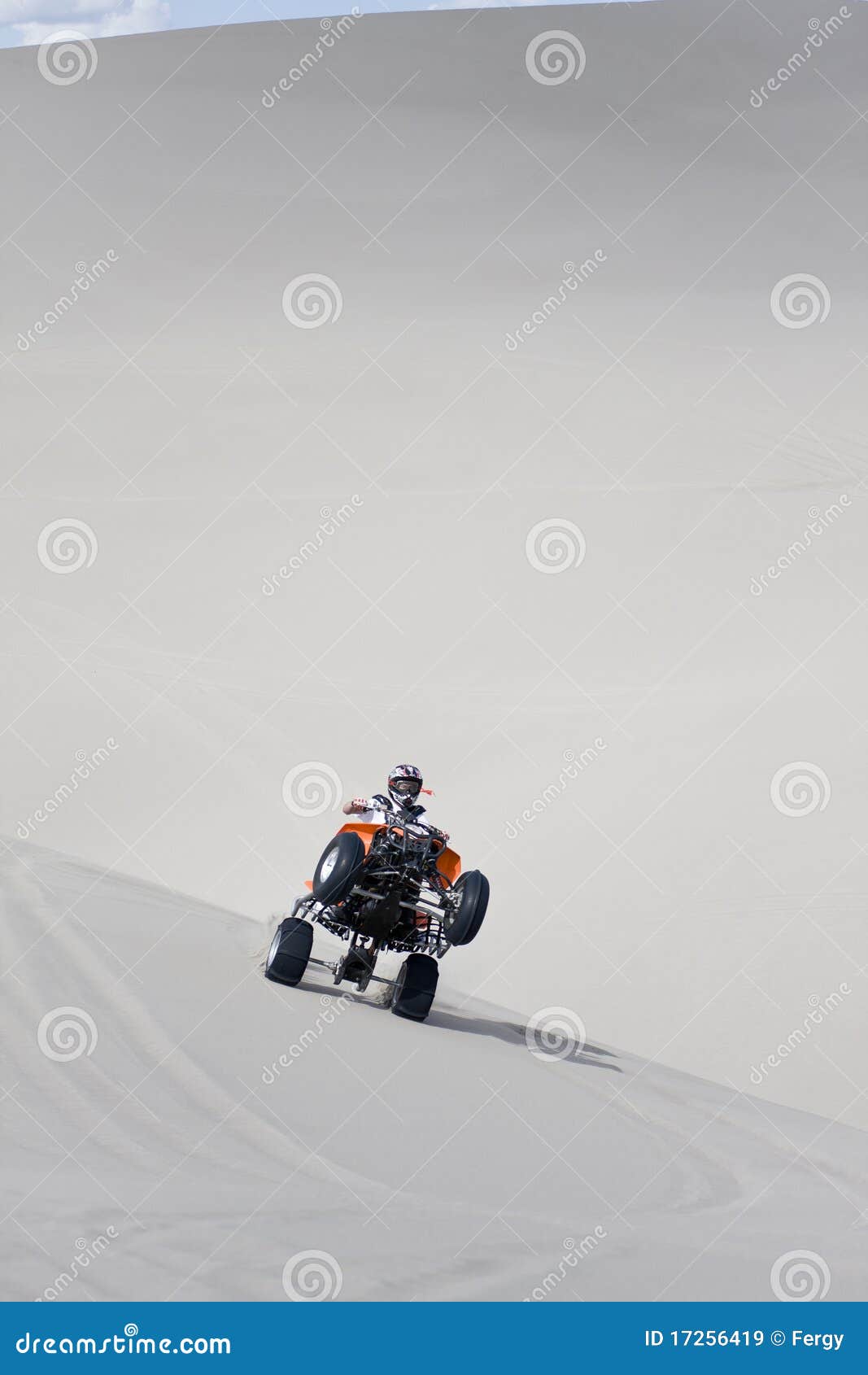 Riding ATV in sand dunes stock image. Image of angle - 17256419
