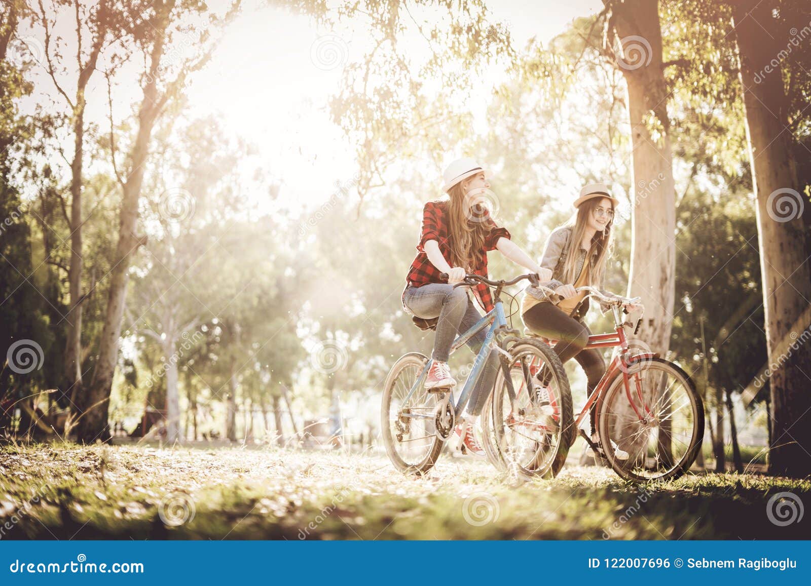 Riding bicycle in the park stock photo. Image of green - 122007696