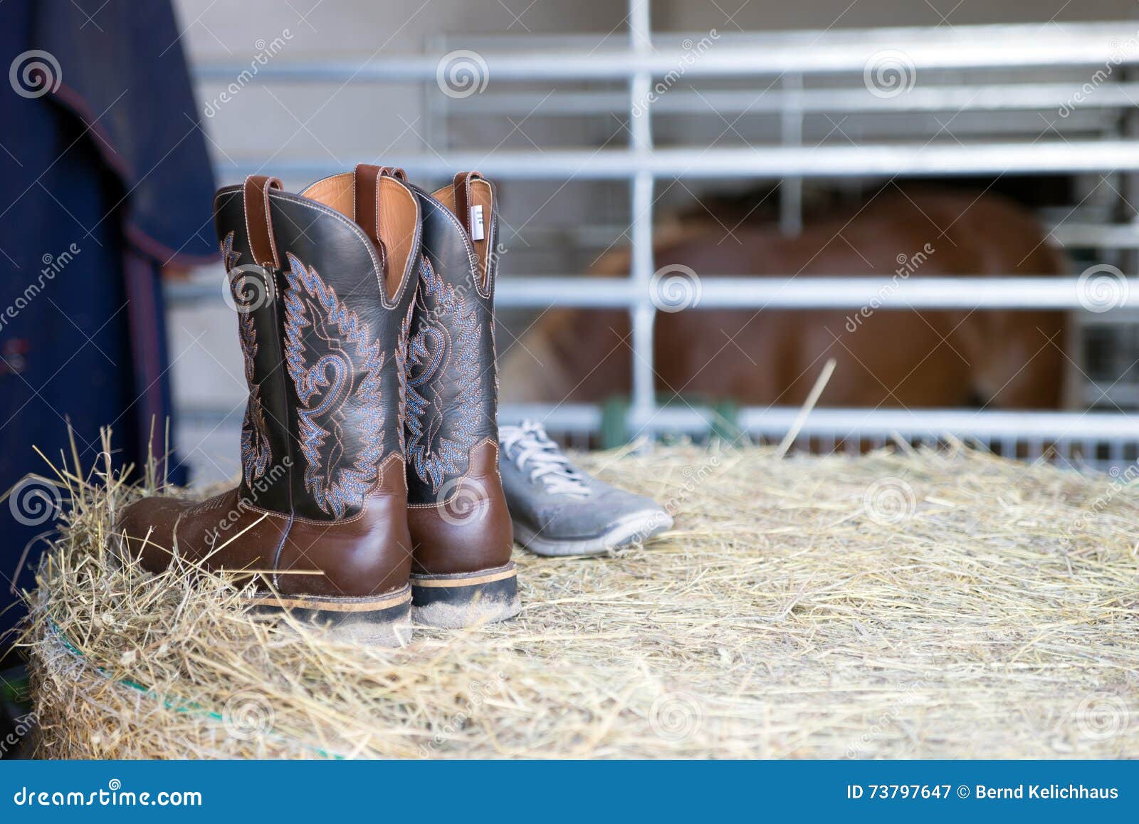 Riding boots in stables stock image. Image of bales, straw - 73797647
