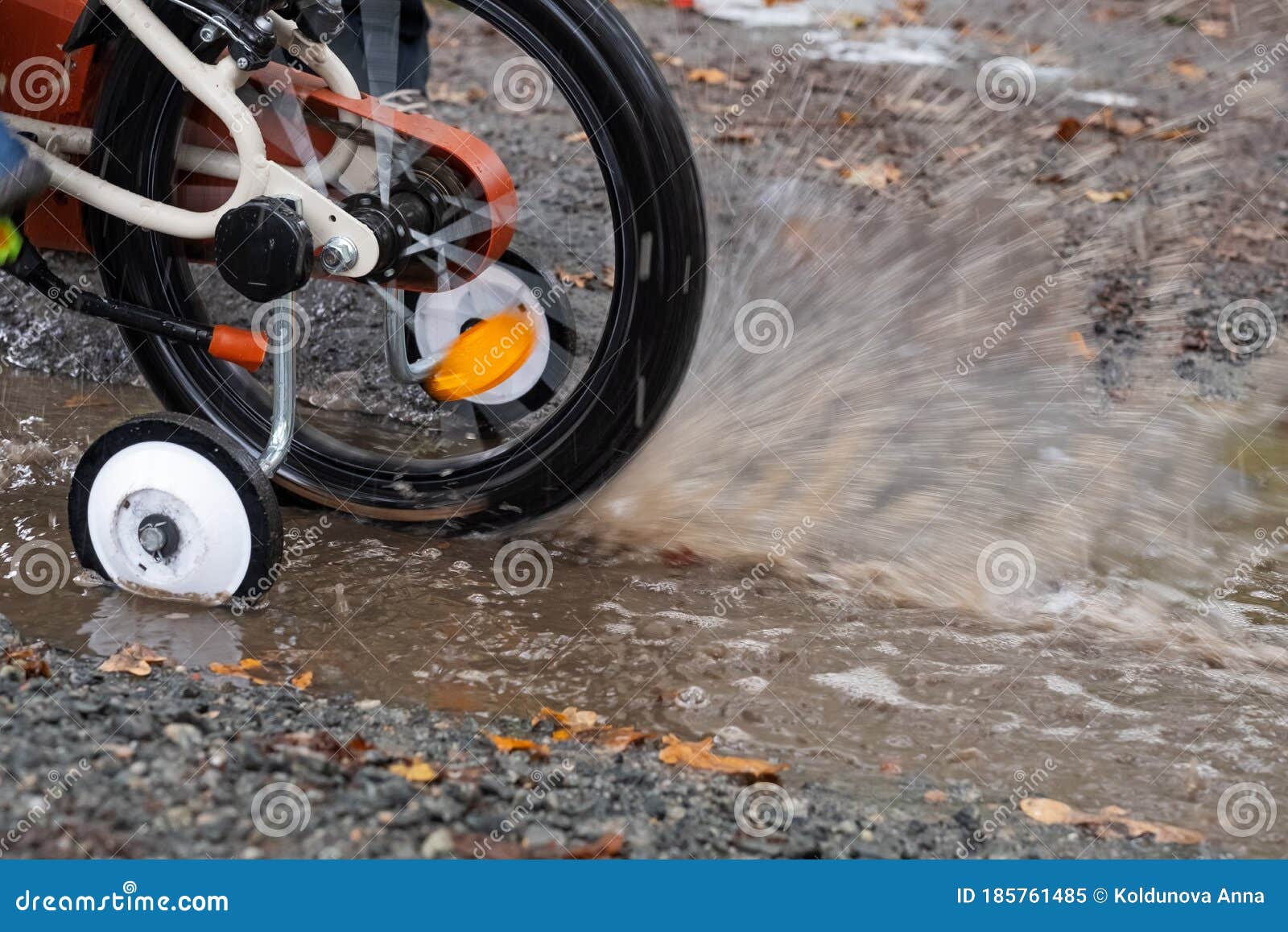 Riding on Bycicle on Puddle Learning To Bike. Stock Image - Image of ...