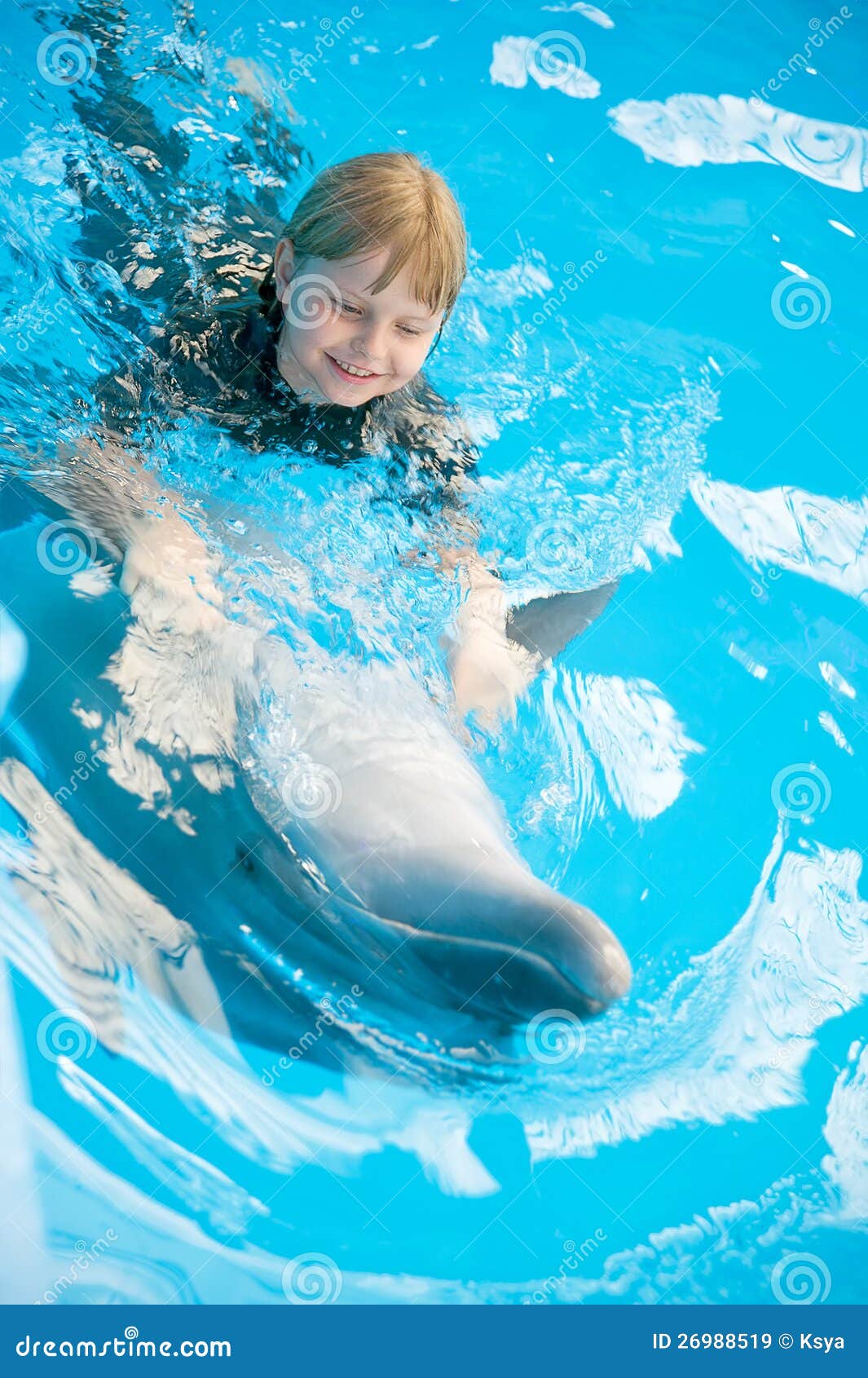 Riding on a dolphin stock image. Image of black, girl - 26988519