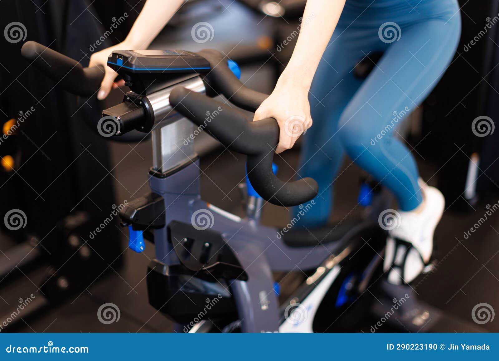 Riding on exercise bike stock photo. Image of asian - 290223190