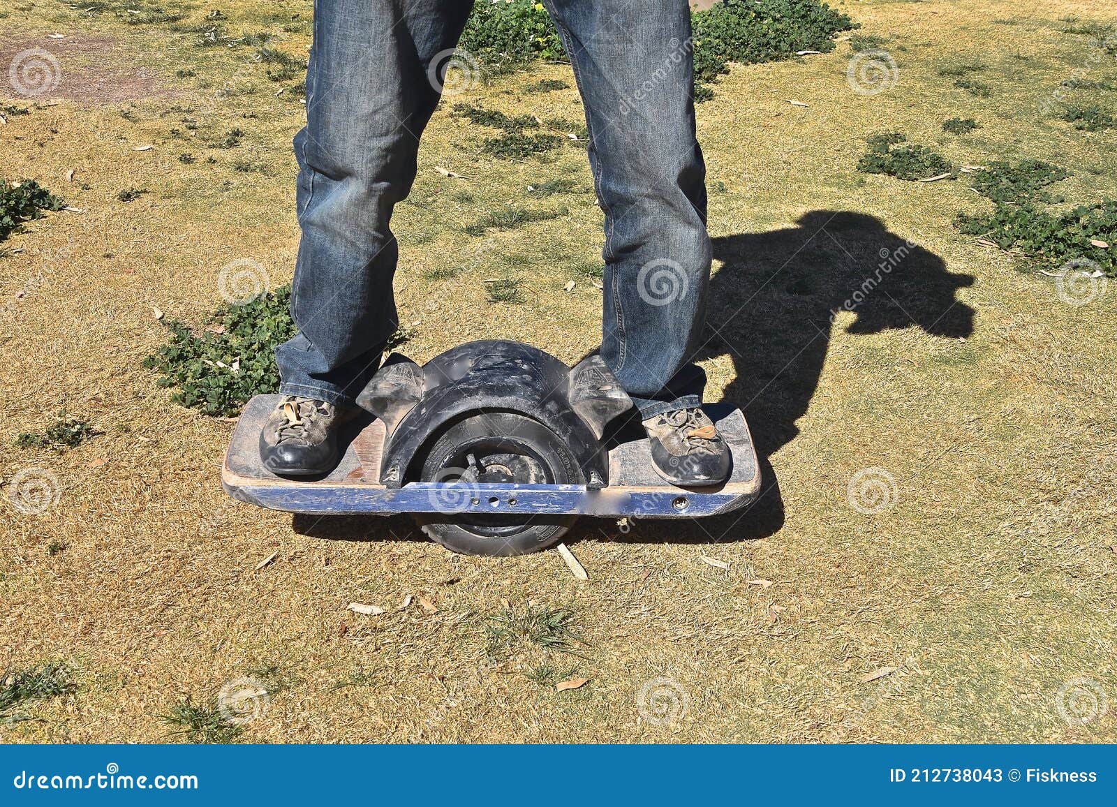 Riding a one wheel scooter stock image. Image of skill - 212738043