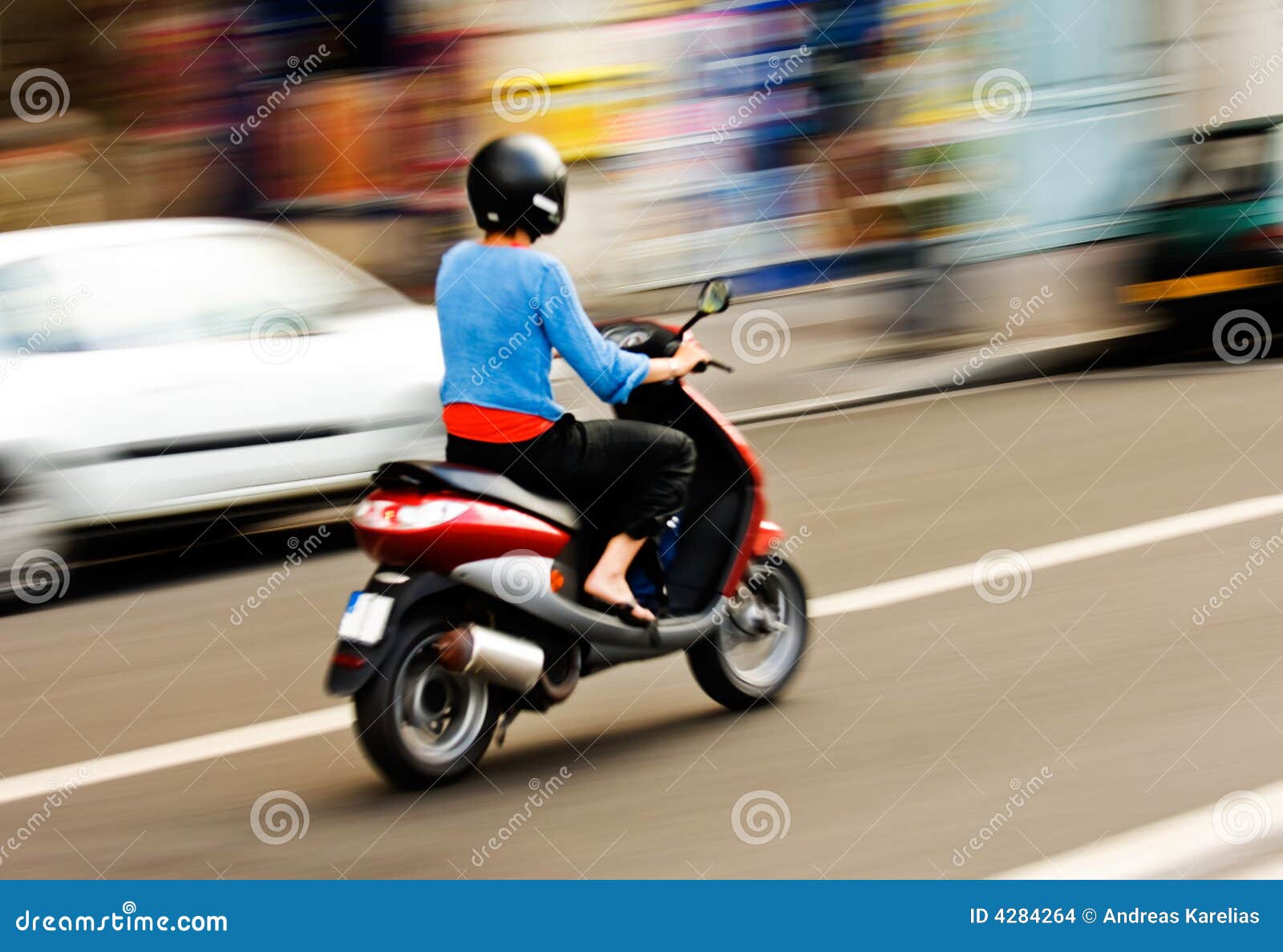 Riding a scooter stock photo. Image of motorcyclist, street - 4284264
