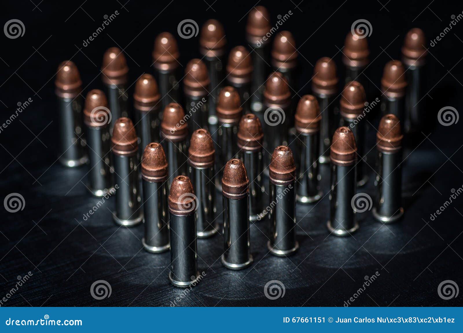 Rifle bullets over table stock image. Image of cartridge - 67661151