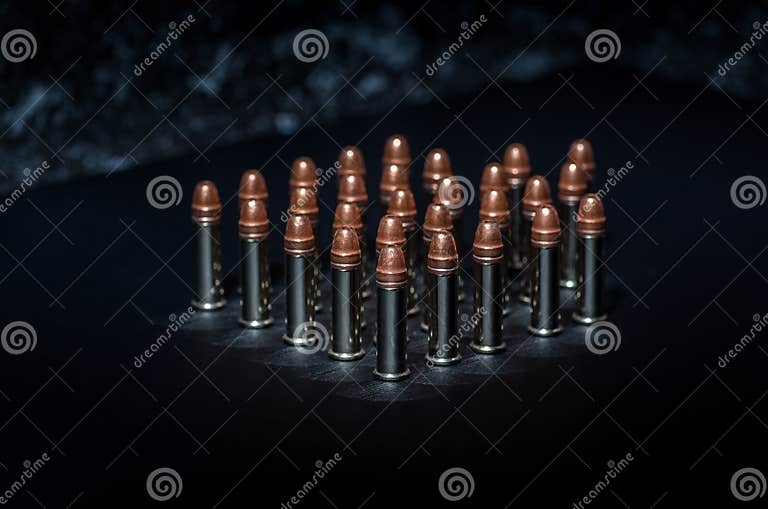 Rifle bullets over table stock image. Image of bullet - 67661243