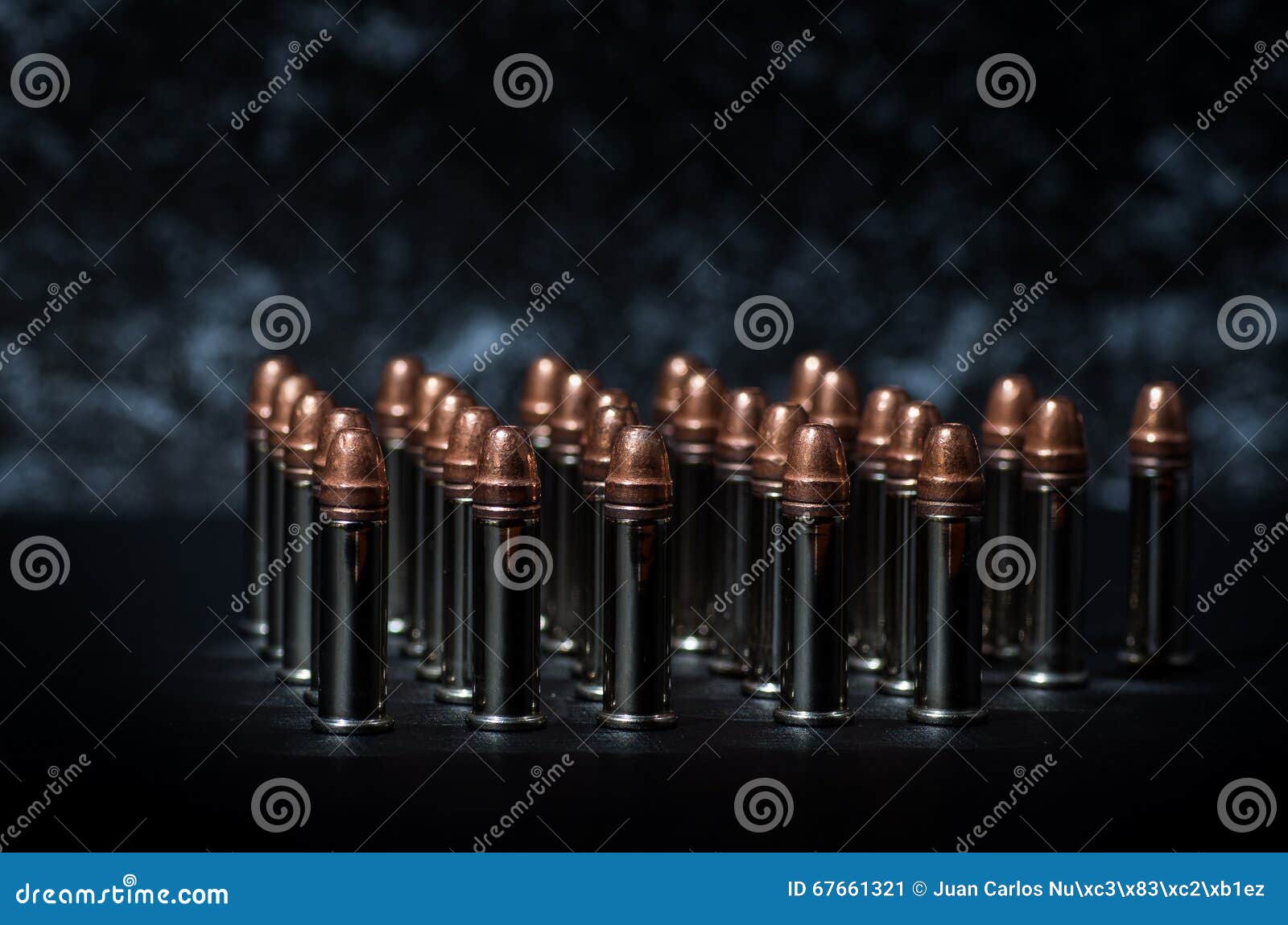 Rifle bullets over table stock image. Image of table - 67661321