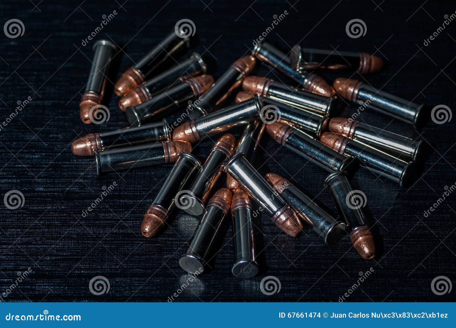 Rifle bullets over table stock photo. Image of table - 67661474