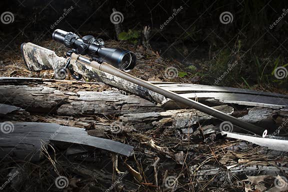 Rifle and Scope on a Dead Log Stock Photo - Image of shooting, recoil ...