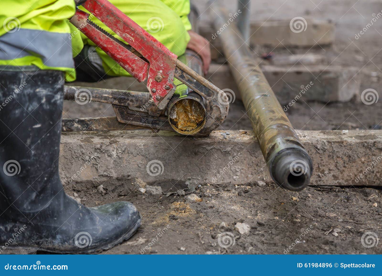 Geologist Taking Inclinometer Readings On Road, Measuring Slope ...
