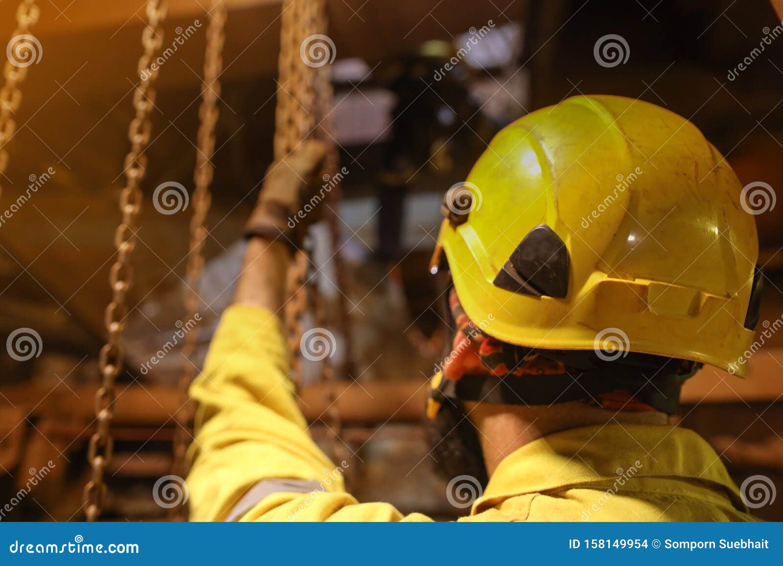 Worker With Crane Chain On Scaffolds Vertical Royalty-Free Stock Photo ...