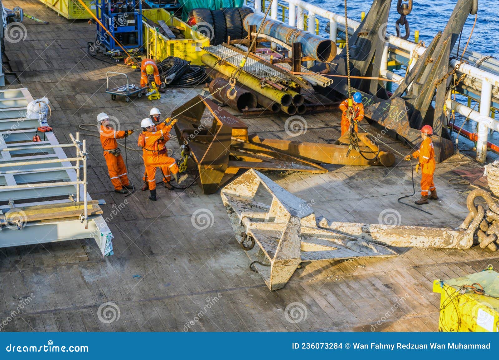 Riggers Working On Anchor Handling On A Construction Wok Barge At ...