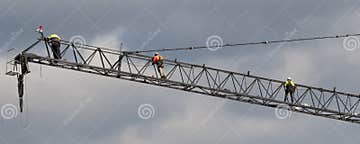Riggers Up High Assembling and Erecting a Construction Tower Crane ...