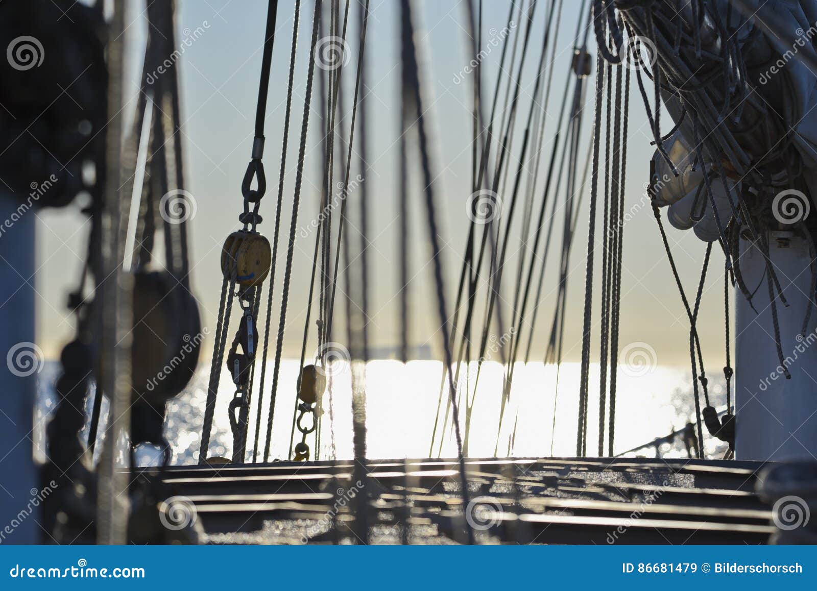 Looking Up The Rigging Of A Sailing Dinghy: Red Sail, Wooden Mast Stock ...