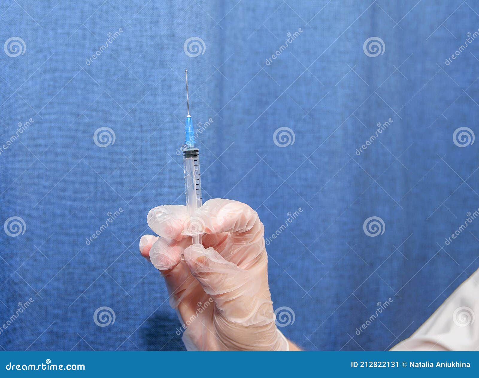 Right Gloved Syringe with Medicine Dripping Down Needle Stock Image ...