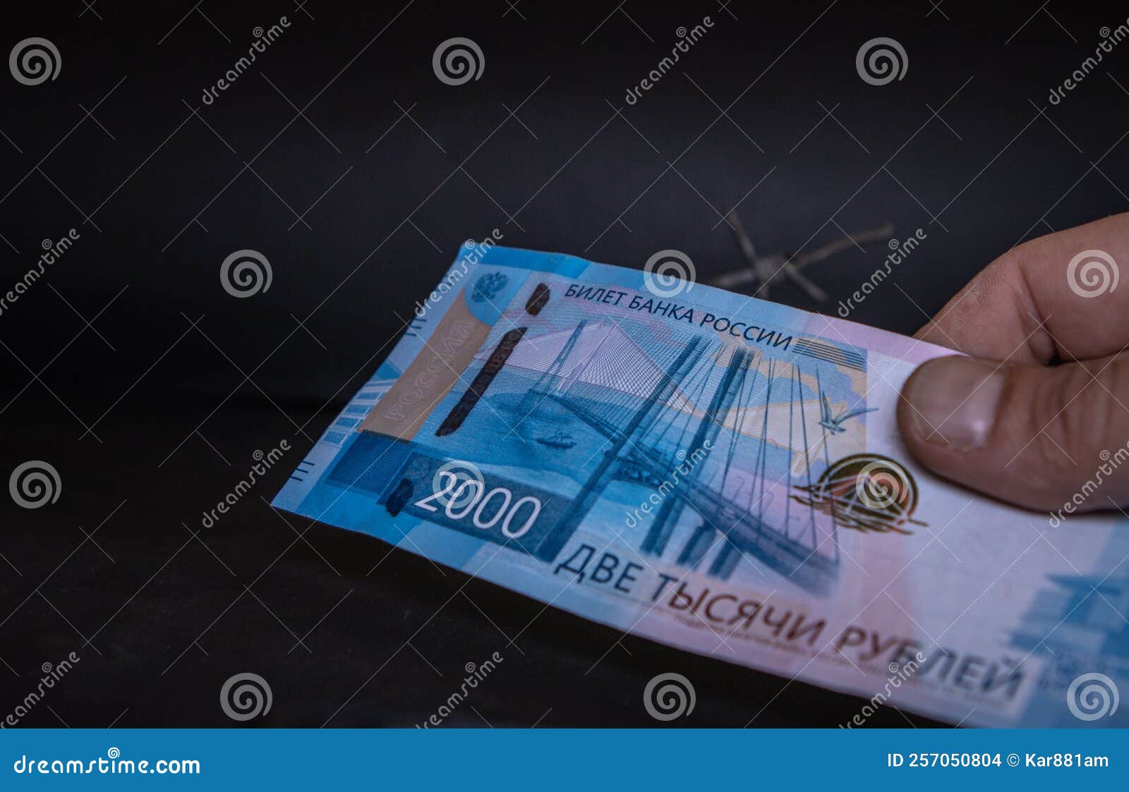 Right Hand Holds Stack of 2000 Russia Ruble Banknote on Black ...