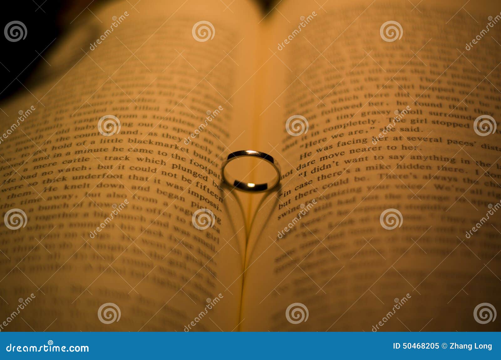 Ring in the Book with a Heart-shaped Shadow Stock Image - Image of ...