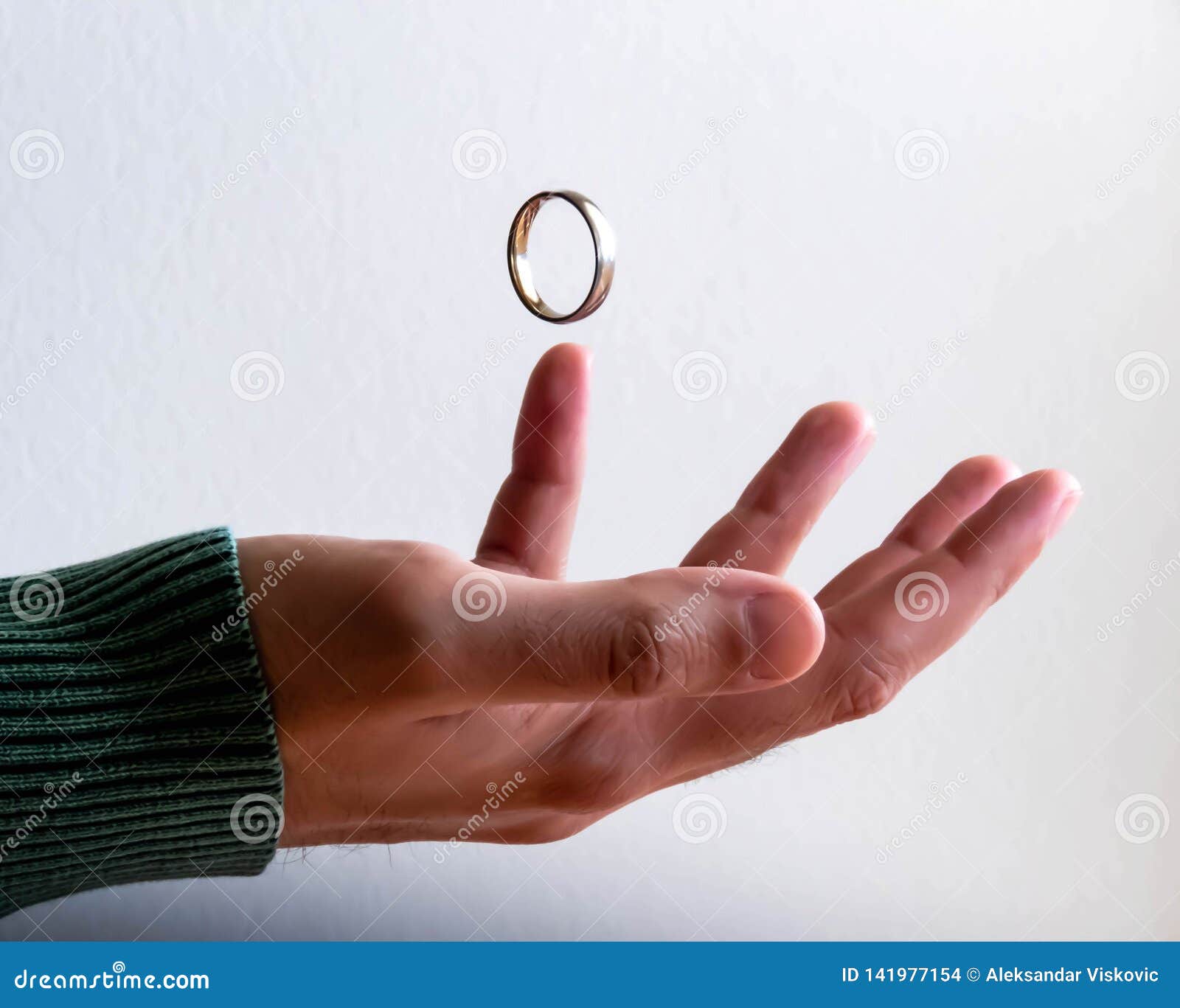 Floating ring above hand stock photo. Image of present - 141977154