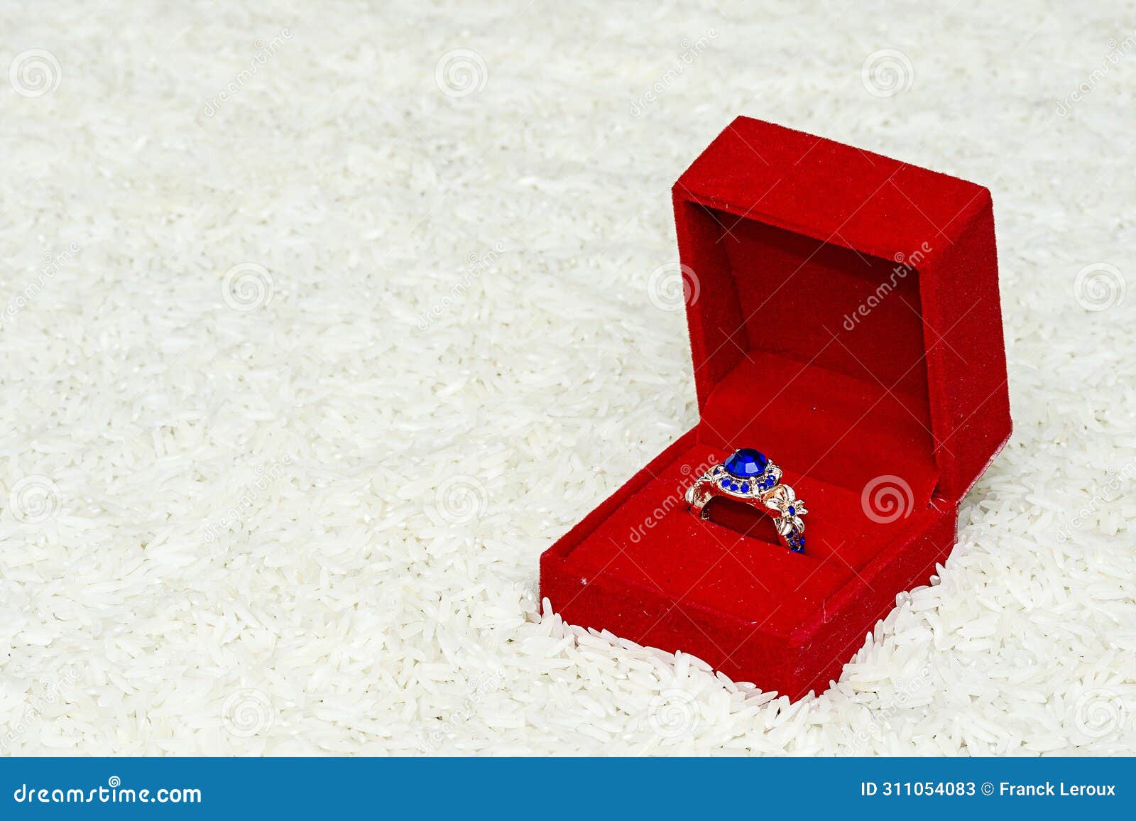 Ring in a Jewelry Box on Rice Background Creating a Sharp White ...