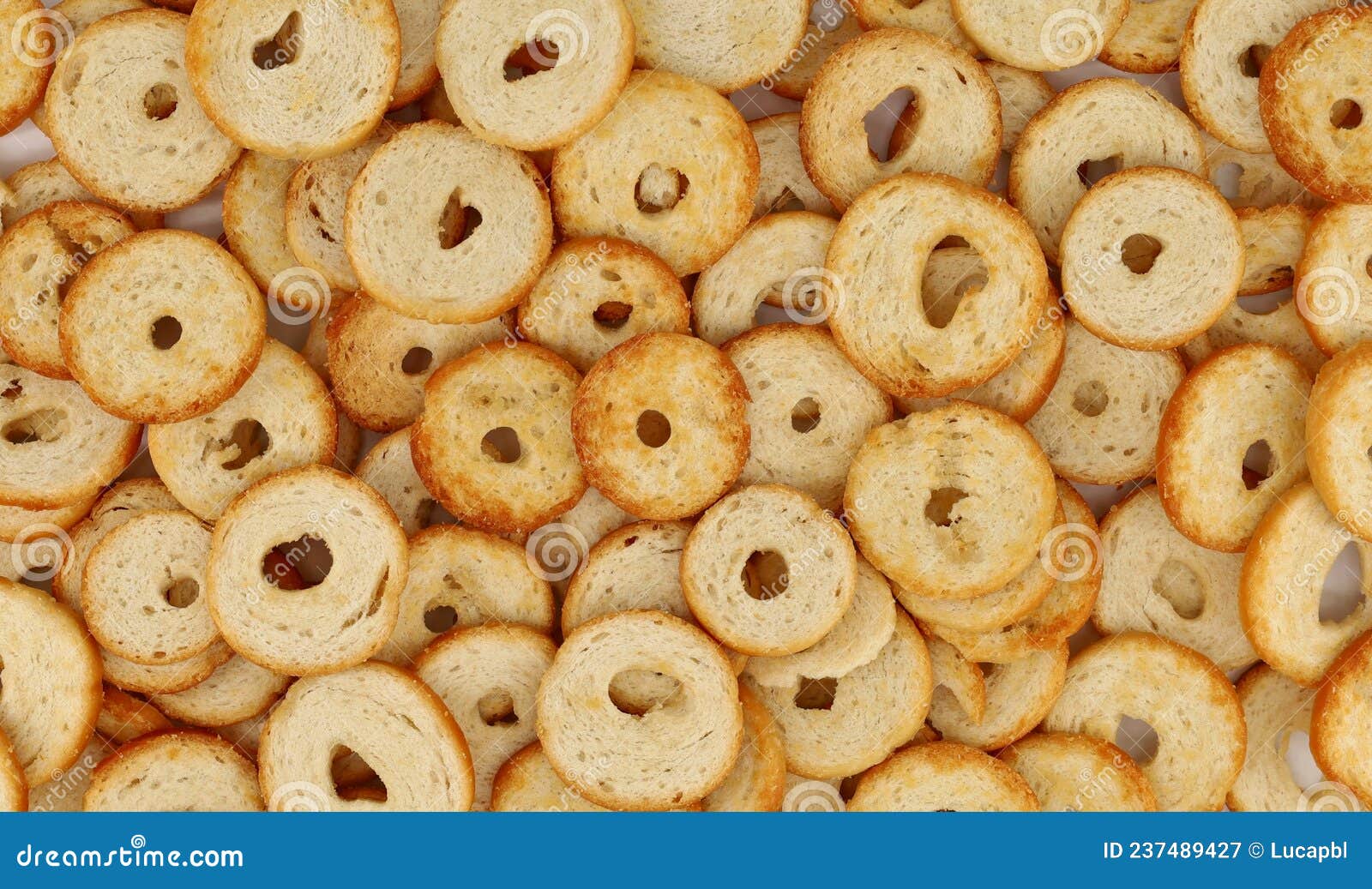 Ring Shaped Chips of Bread. Full Frame Stock Image - Image of meal ...