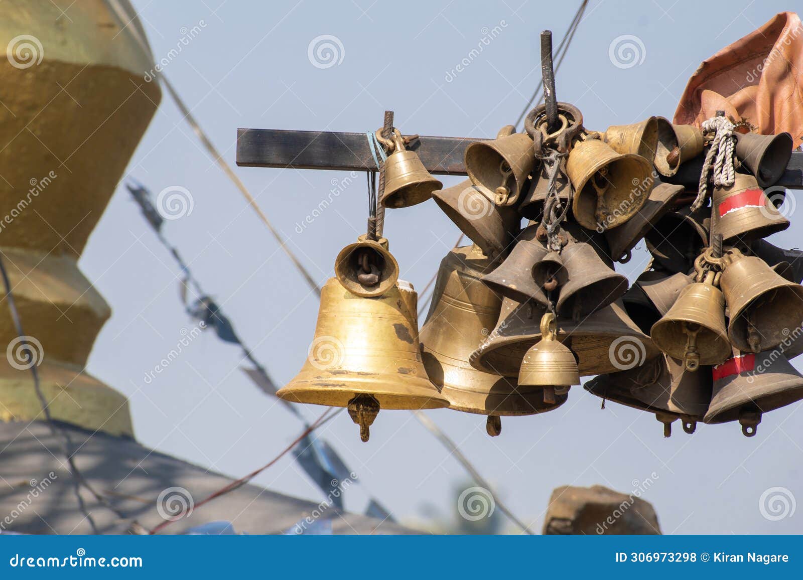 Ringing Bells of a Religious Temple. Brass Praying Bells Hanging on Old ...