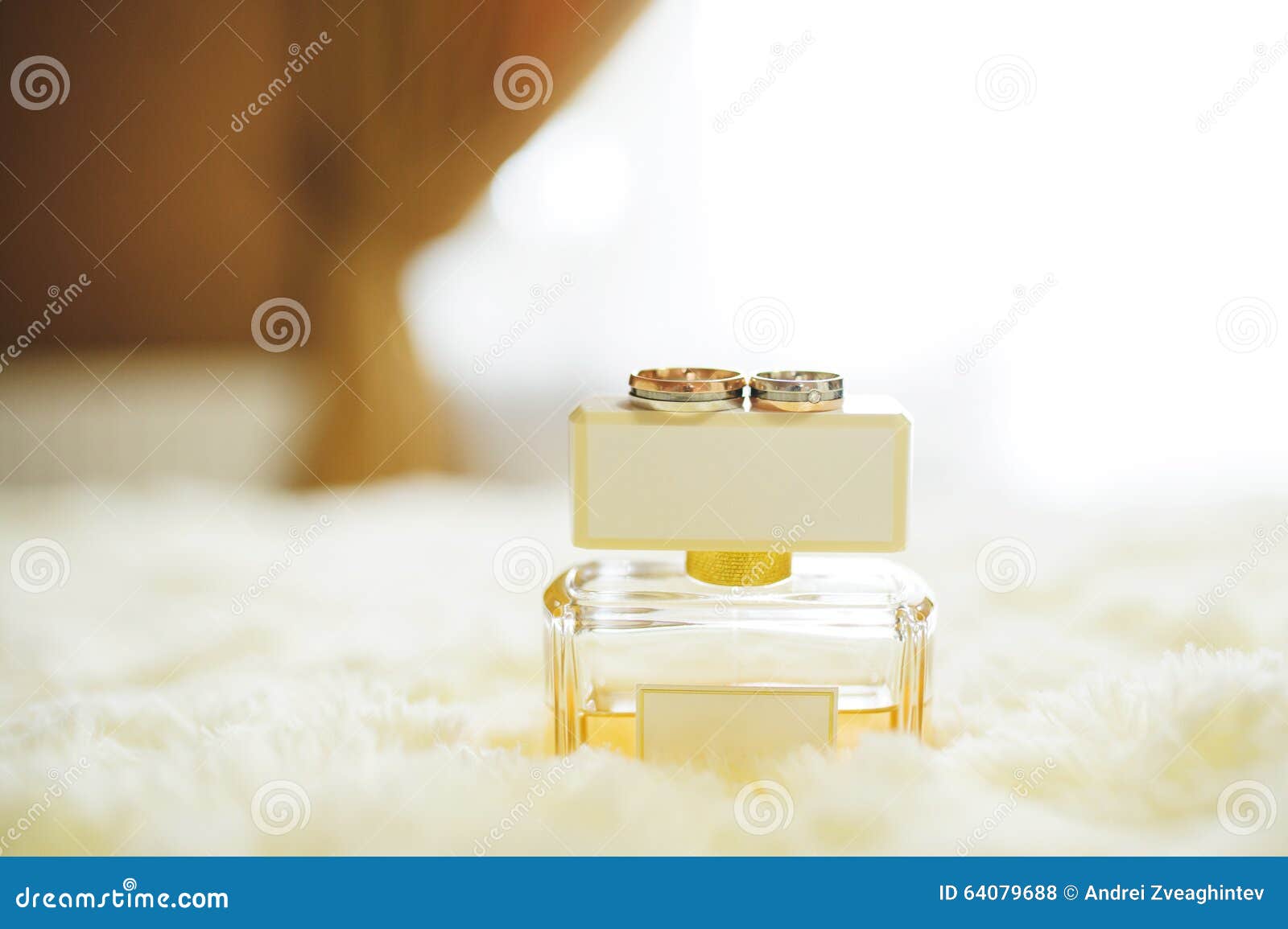 Rings on Perfume Bottle stock photo. Image of marriage - 64079688