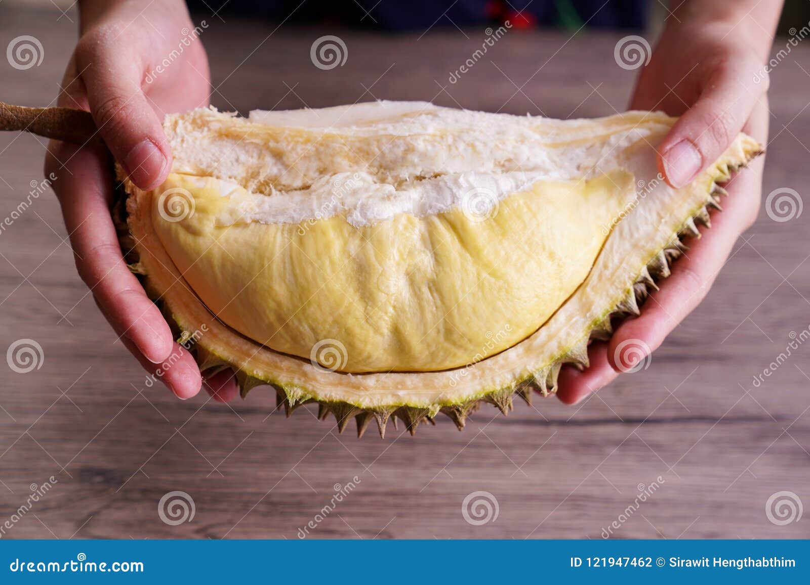 Ripe Durian in Hand on Wooden Table Stock Photo - Image of delicious ...