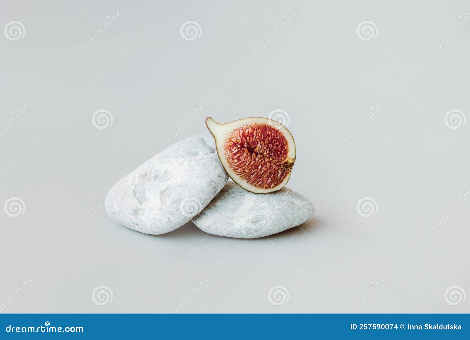 Ripe Fig with Stones on a Grey Background. Minimal Concept Stock Photo ...