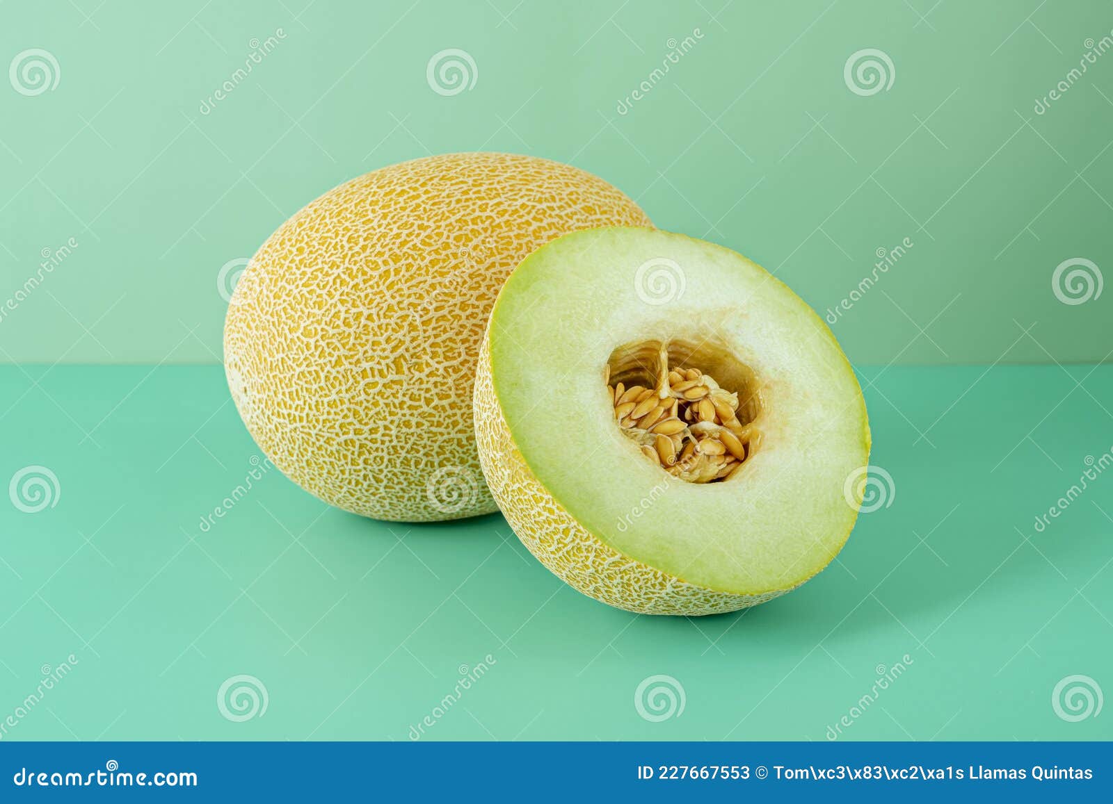 Ripe Gaul Melons. a Melon Split in Half Showing Its Seeds on a Plain ...