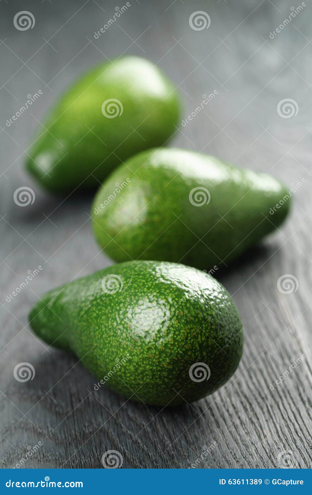 Ripe Green Avocados on Wood Table Stock Image - Image of closeup ...