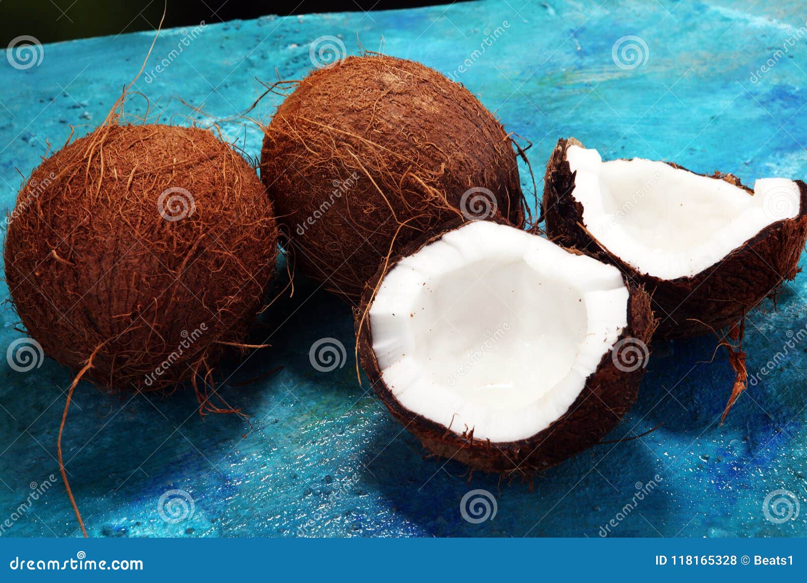Ripe Half Cut Coconut on a Blue Background Stock Photo - Image of ...