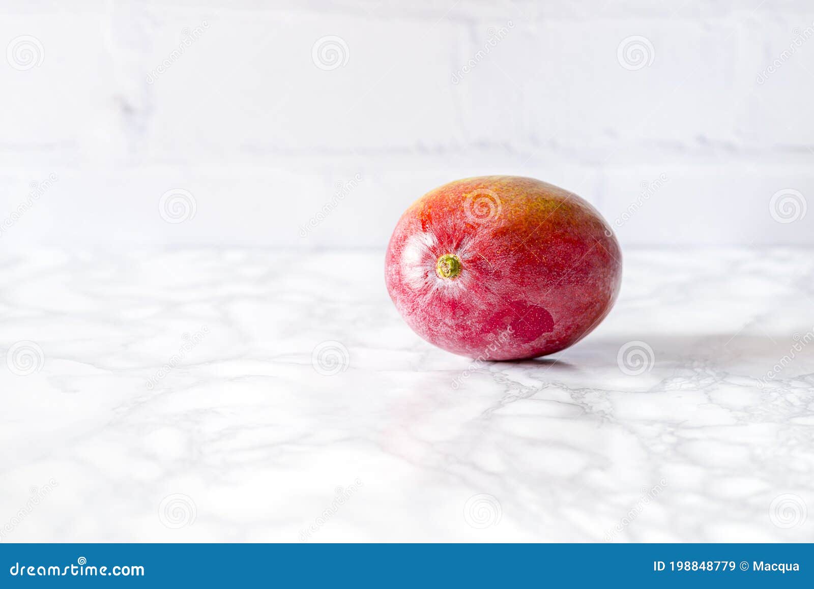 Ripe Mango Isolated on White White Marble Background. Front View Stock ...
