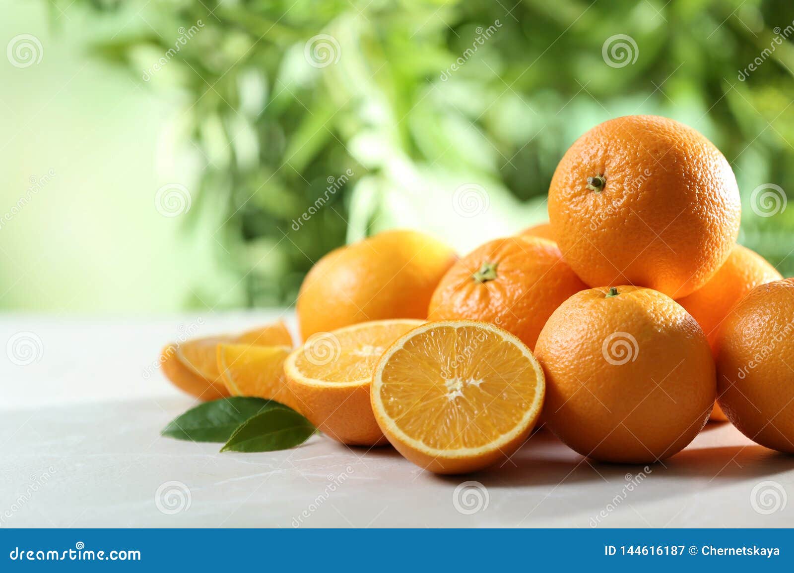 Ripe Oranges on Table Against Blurred Background. Stock Image - Image ...