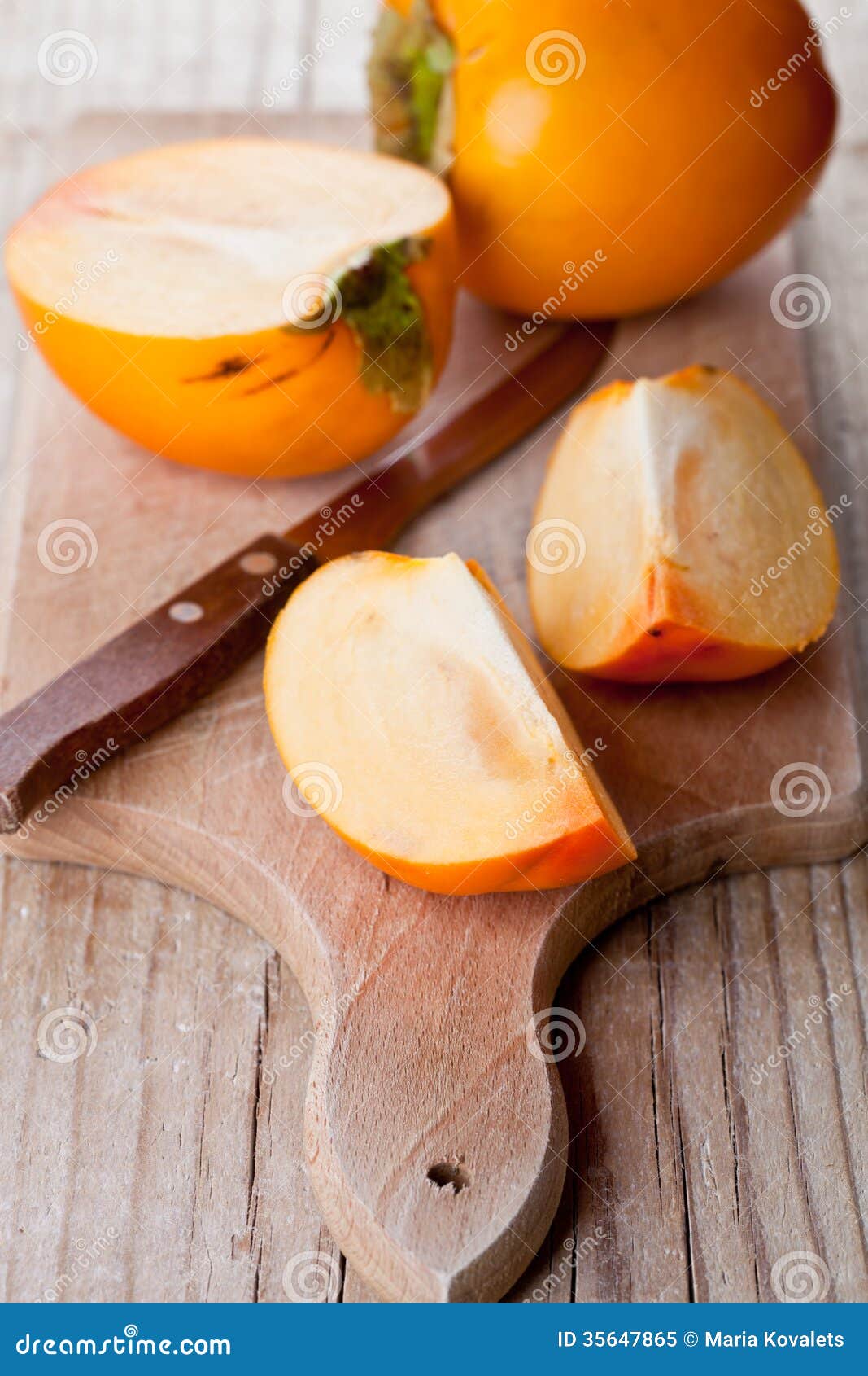 Ripe persimmons and knife stock image. Image of piece - 35647865