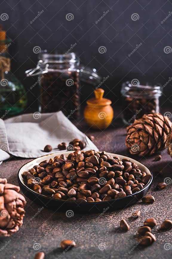 Ripe Pine Nuts in the Shells on a Plate and Boiled Pine Cones on the ...