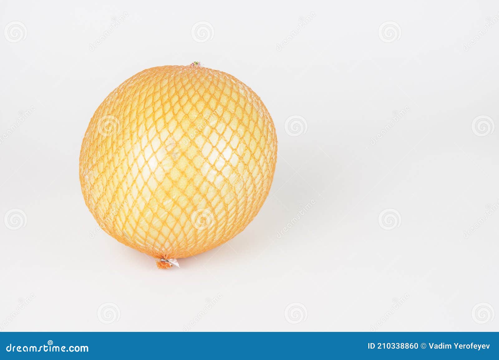 A Ripe Pomelo is Packaged in a Grid Lies on White Background Stock ...