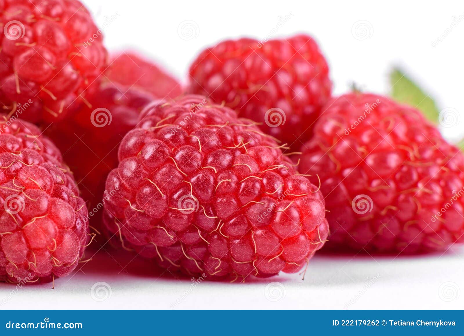 Ripe Raspberries With Raspberry Leaf Isolated On A White Background