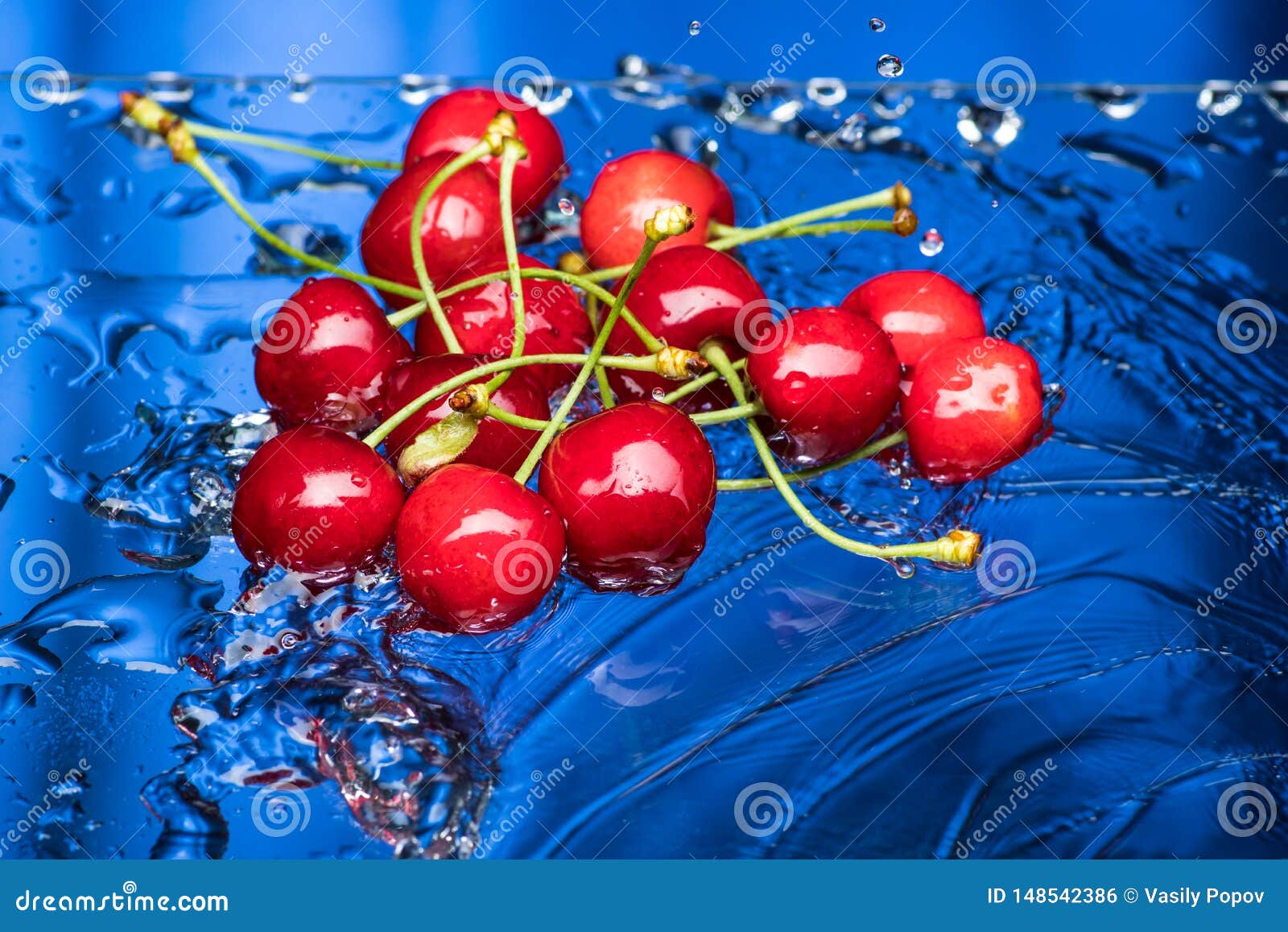 Ripe Red Cherry Abandoned and Falling into the Water Stock Photo ...