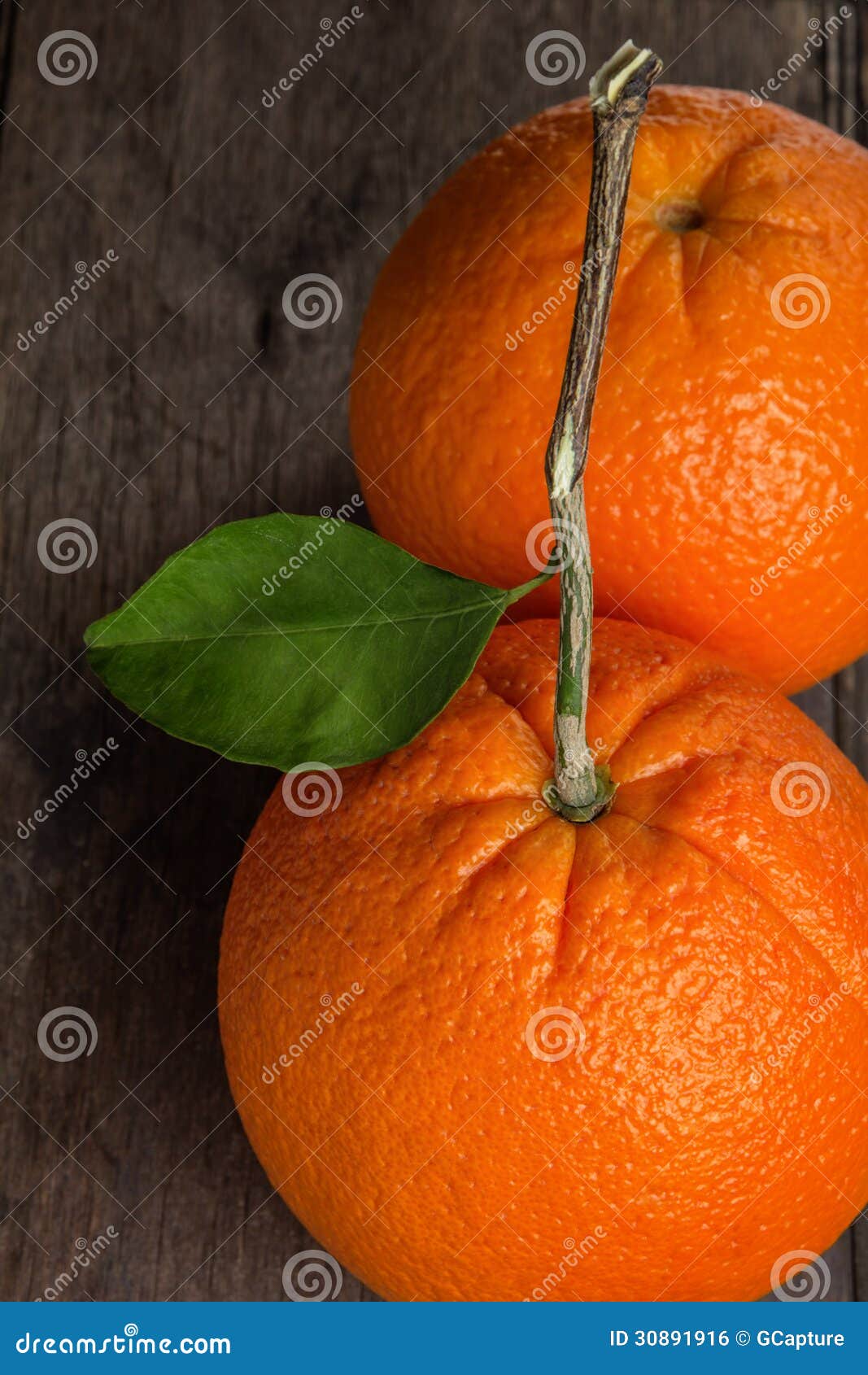 Ripe Round Orange with Stem and Leaf on Wooden Table Stock Photo ...