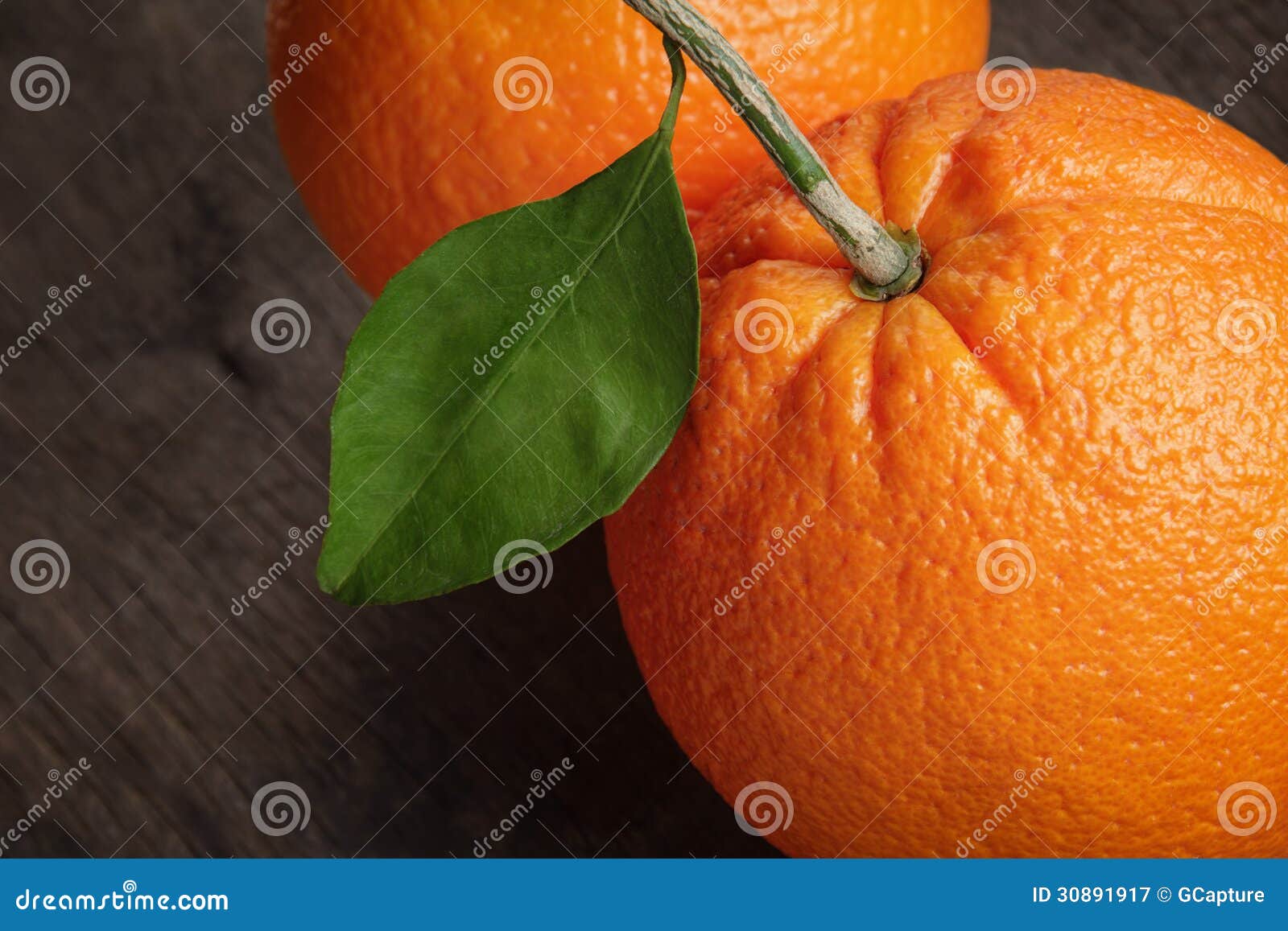 Ripe Round Orange with Stem and Leaf on Wooden Table Stock Image ...