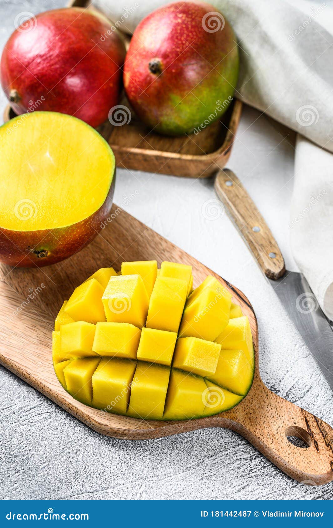 Ripe Sliced Mango Fruit on a Chopping Board. Gray Background Stock ...