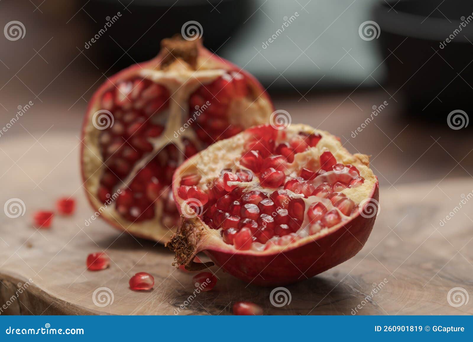Ripe Small Pomegrenate on Olive Wood Board Stock Image - Image of board ...
