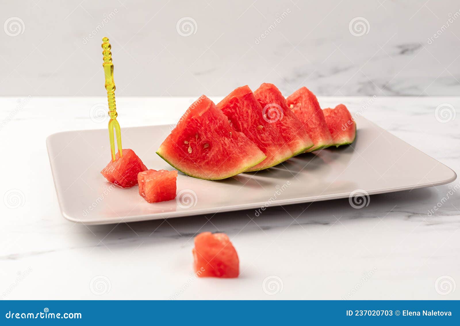 A Ripe Watermelon is Cut into Triangular Segments Lying on a Plate ...